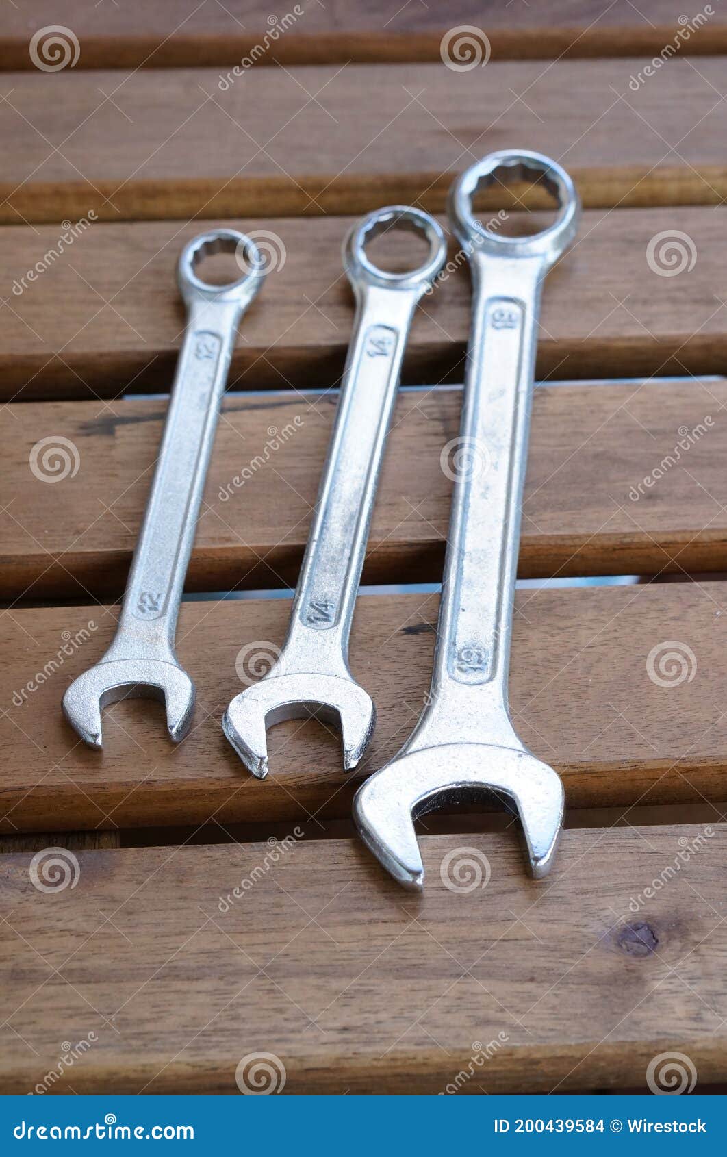 Vertical High Angle Shot of Wrenches on a Wooden Surface Stock Photo ...