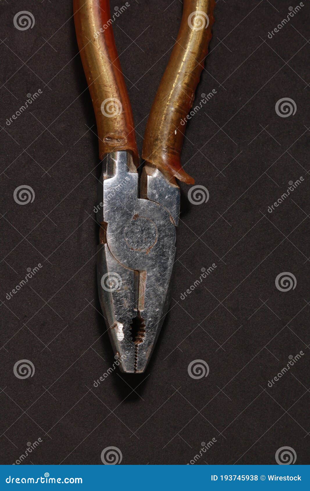 Vertical High Angle Top View Closeup Shot of Pliers on a Black Table ...