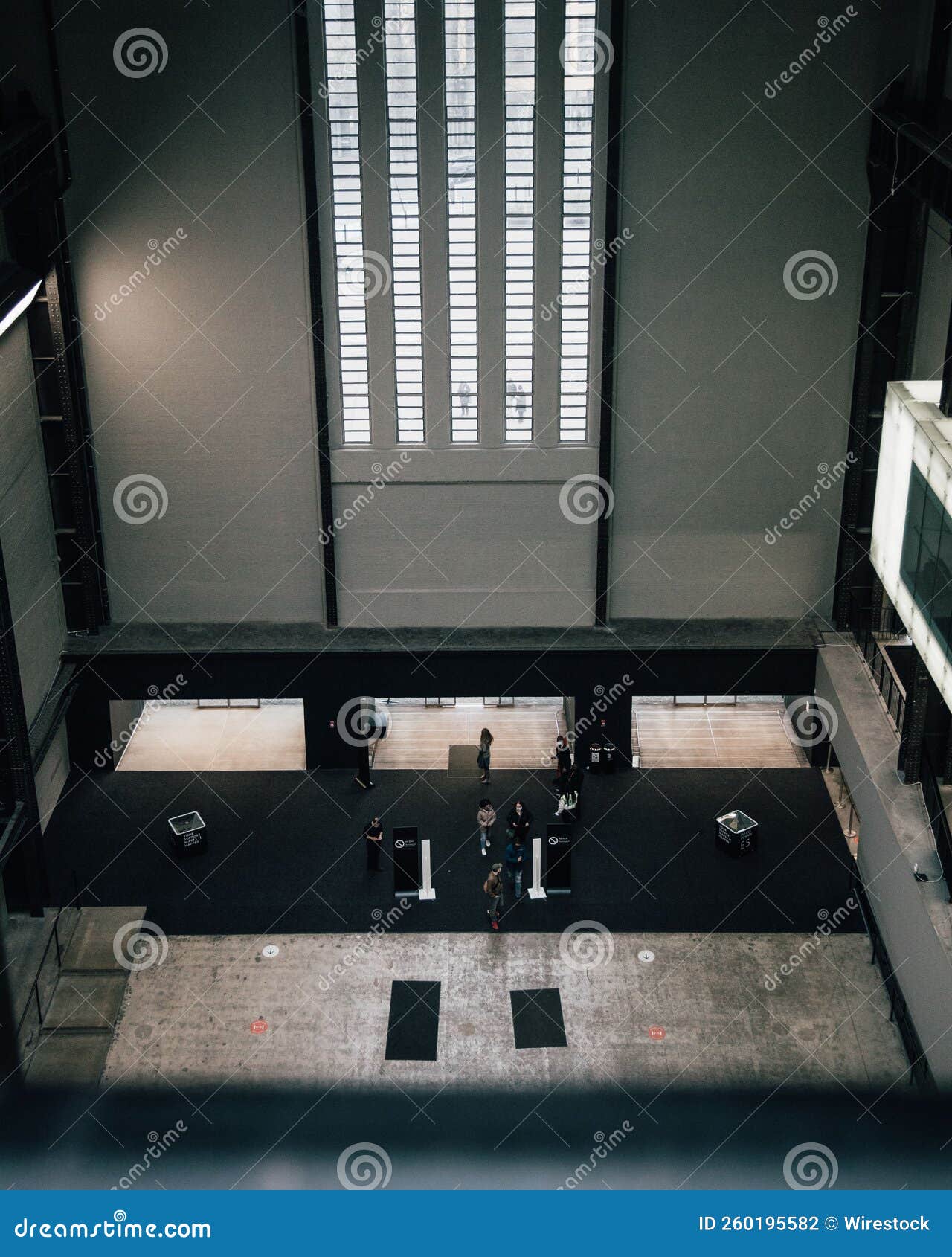 Vertical High-angle View of People in the Hallway Getting Ready for a ...