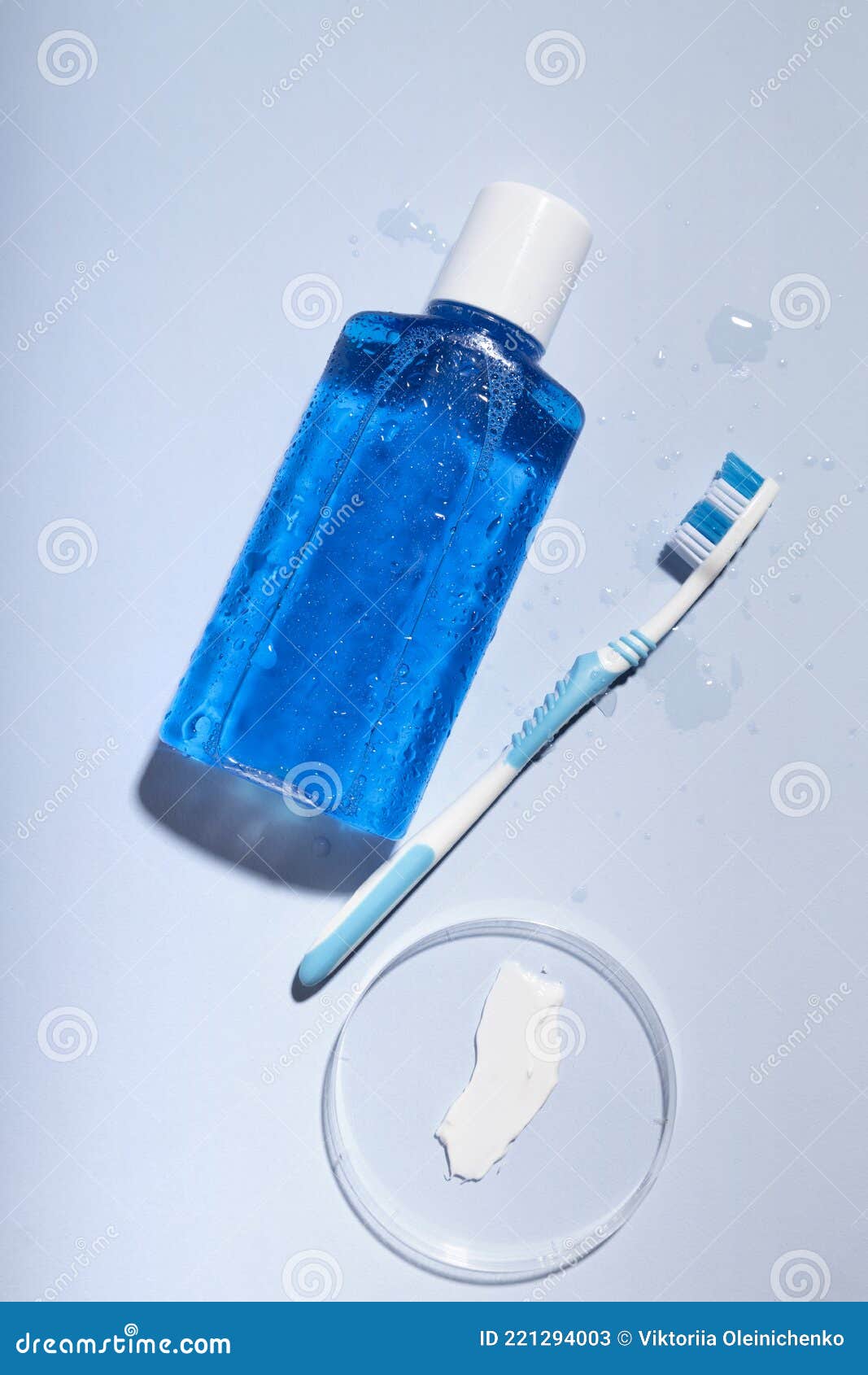 Vertical Image of Bootle of Blue Mouthwash,toothbrush and Sample of ...