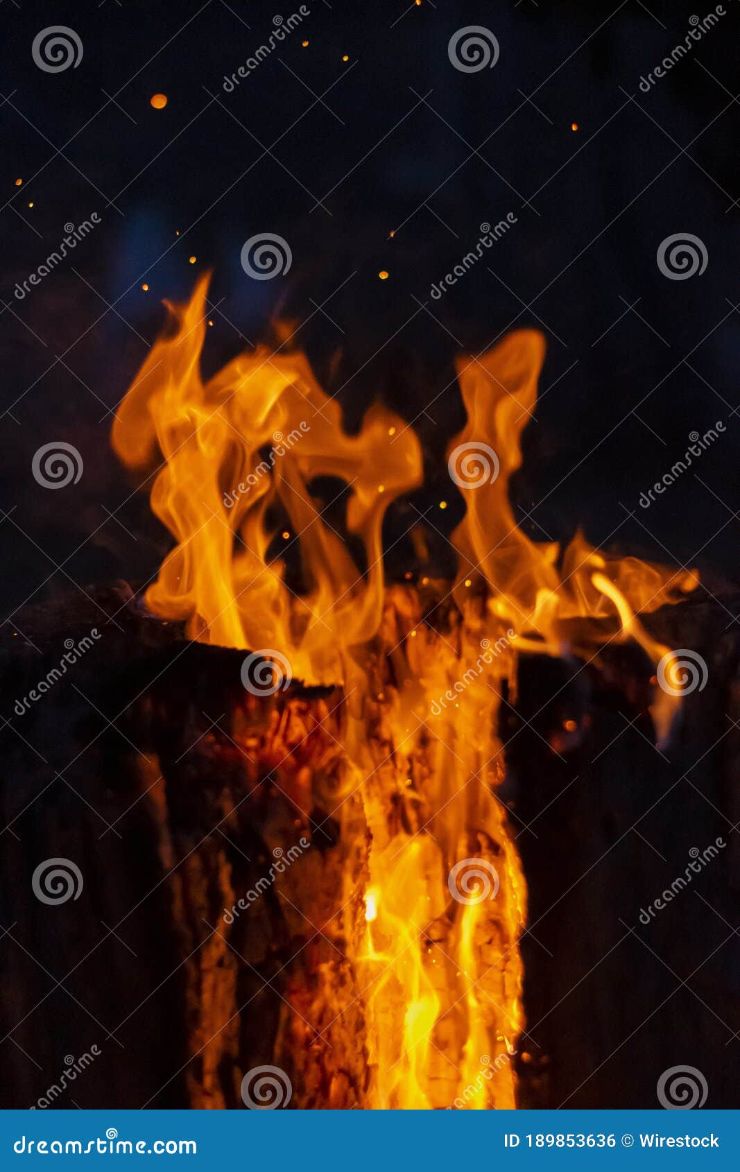 Vertical Image of a Burning Log Creating a Fiery Background Stock Photo ...