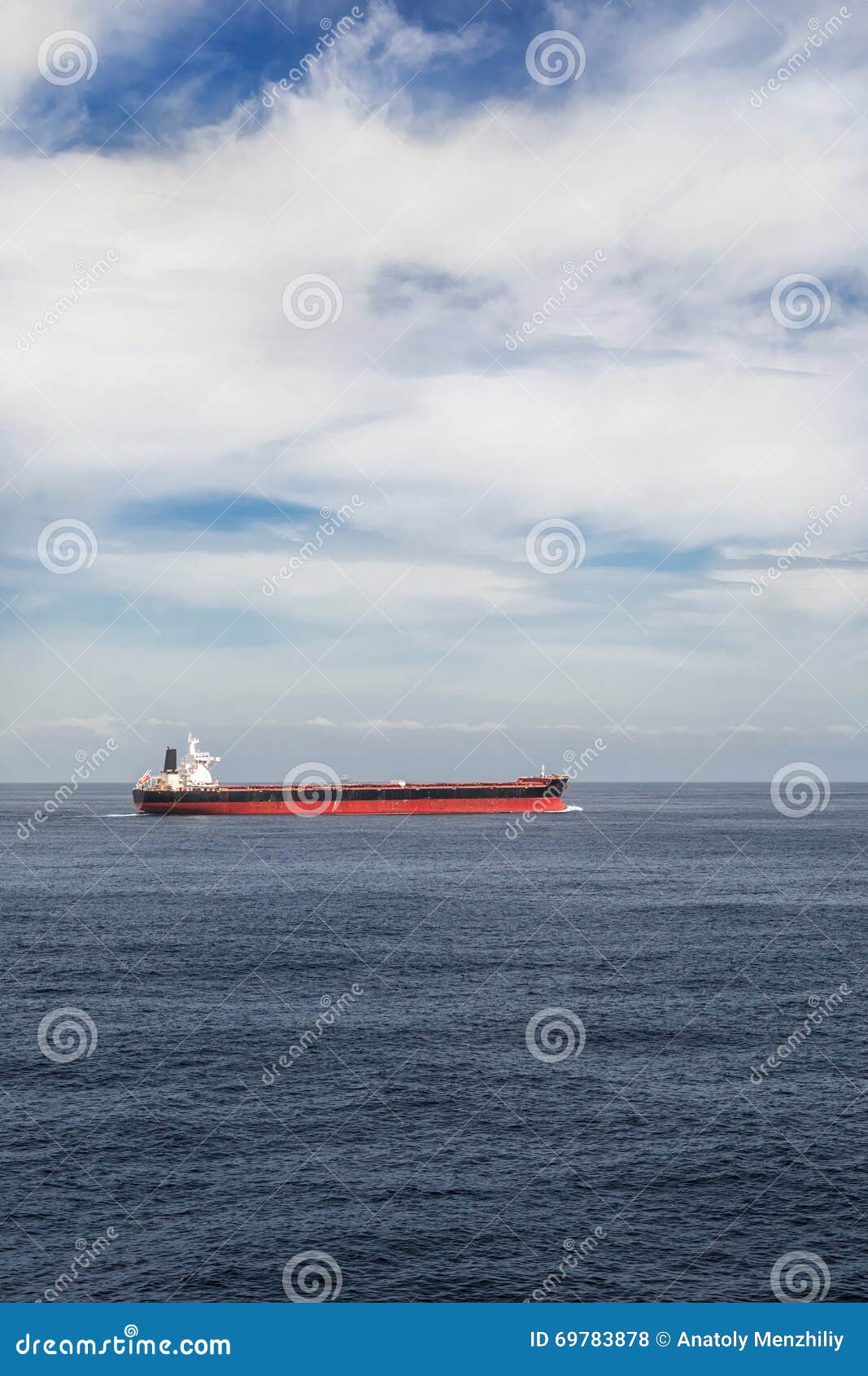 Vertical Image of a Cargo Ship in the Sea Stock Photo - Image of calm ...