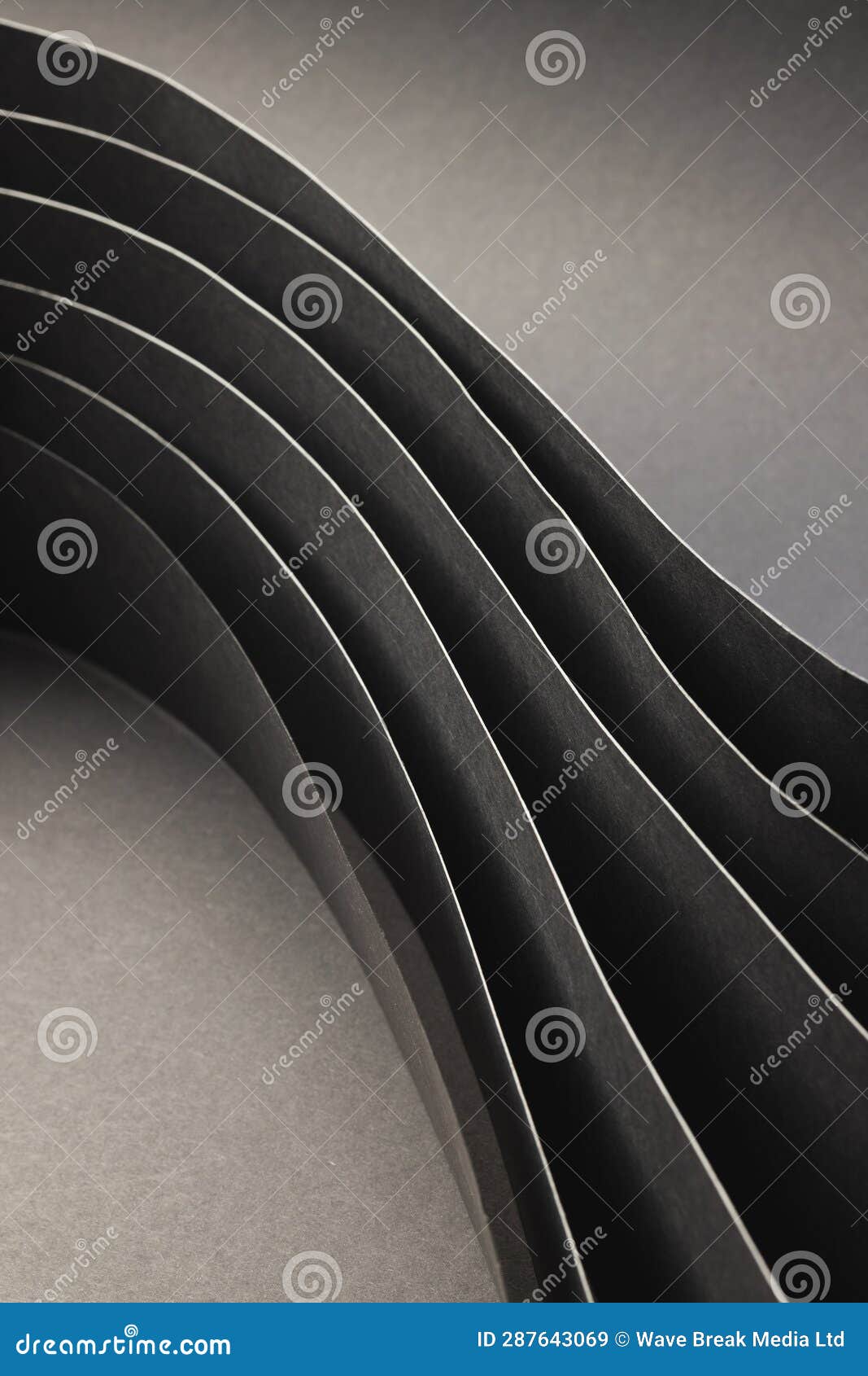 Vertical Image of Close Up of Rolled Up Pieces of Black Paper with Copy ...