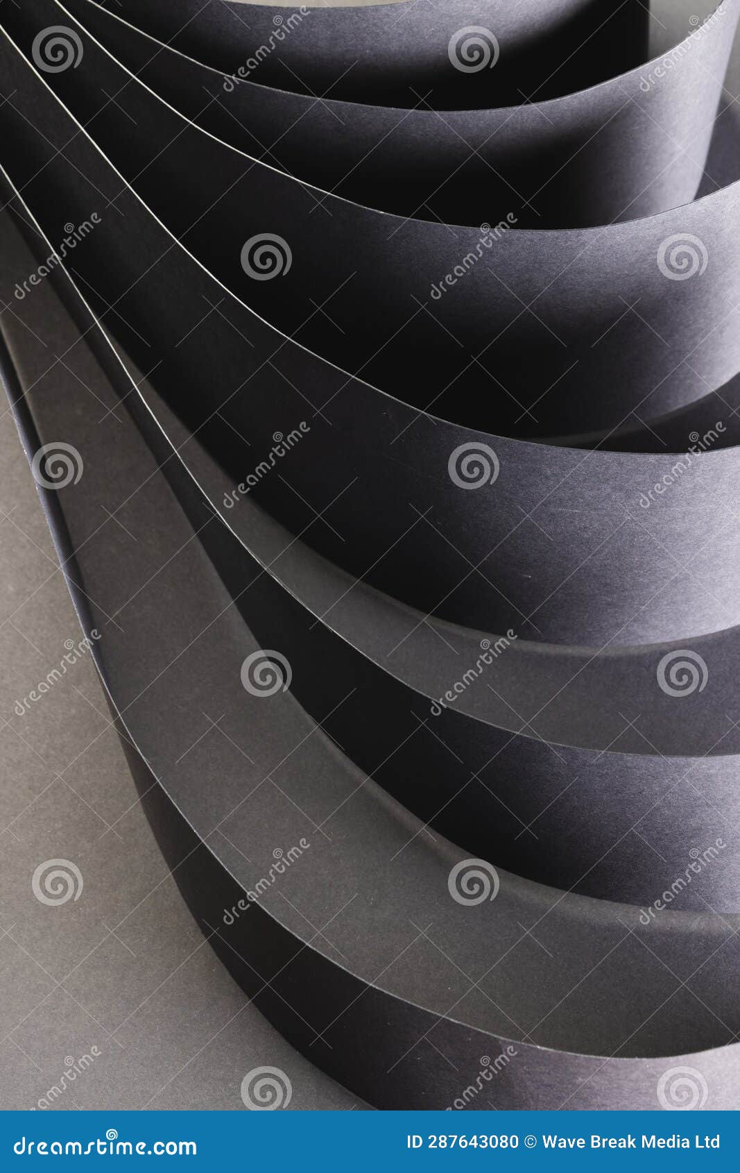 Vertical Image of Close Up of Rolled Up Pieces of Black Paper with Copy ...