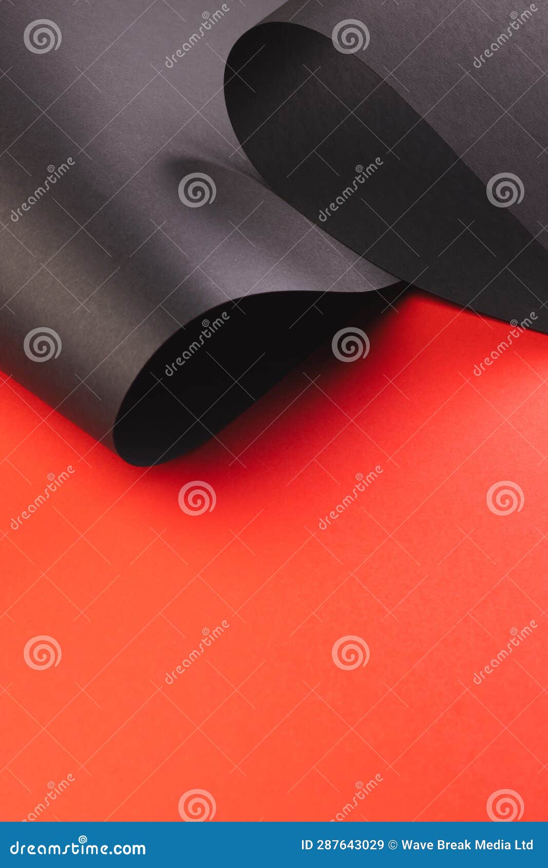 Vertical Image of Close Up of Rolled Up Pieces of Black Paper with Copy ...