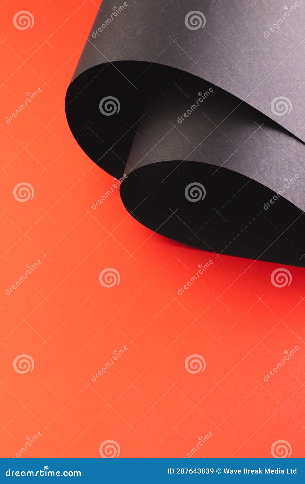 Vertical Image of Close Up of Rolled Up Pieces of Black Paper with Copy ...