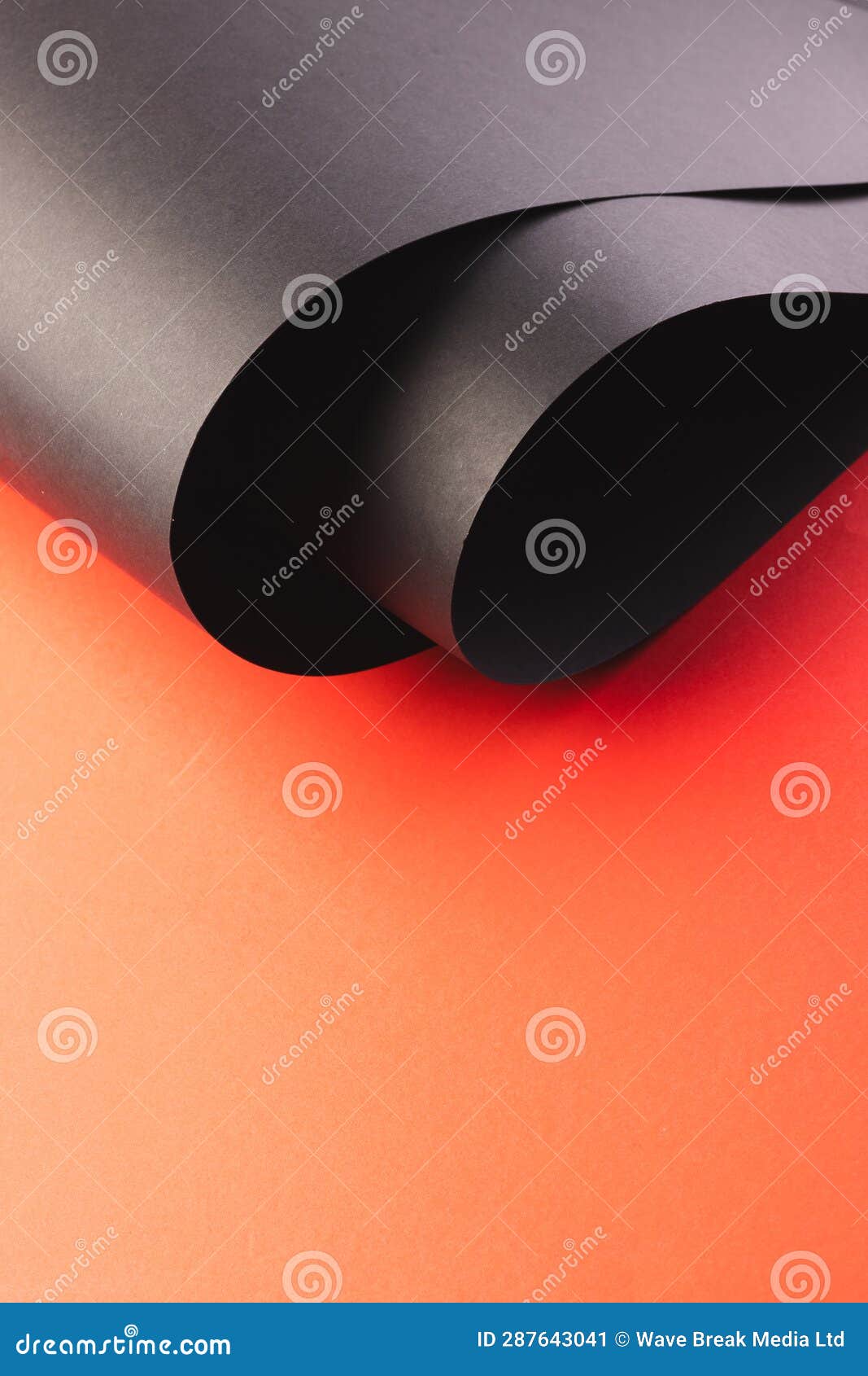 Vertical Image of Close Up of Rolled Up Pieces of Black Paper with Copy ...