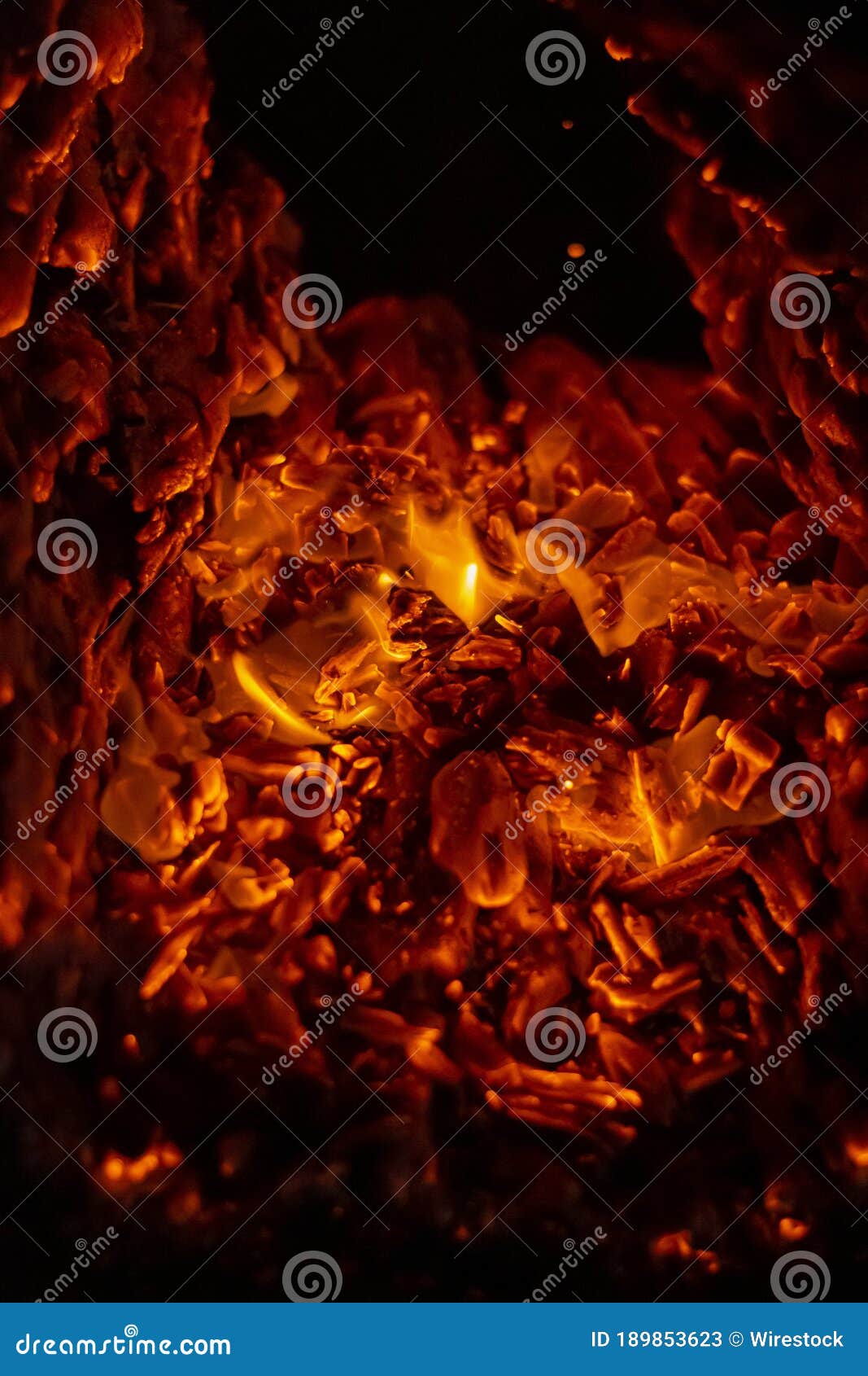 Vertical Image of Embers of a Burning Log Creating a Fiery Background ...