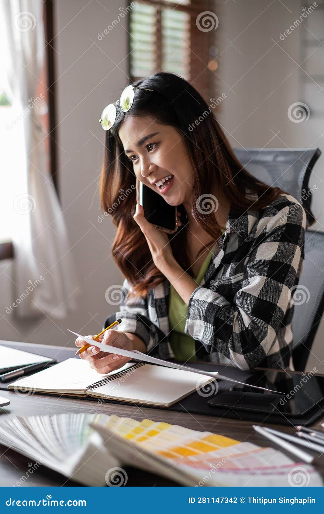 Graphic Designer Talk about Work with Mobile Phone at Office Stock ...