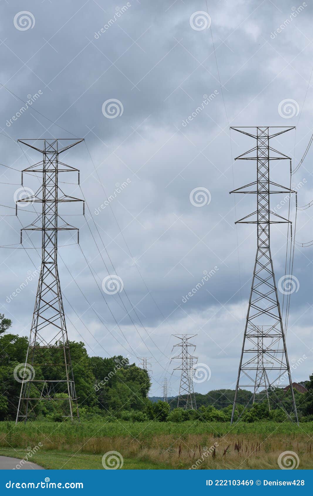 High Voltage Power Lines with Dark Storm Clouds in the Background Stock ...