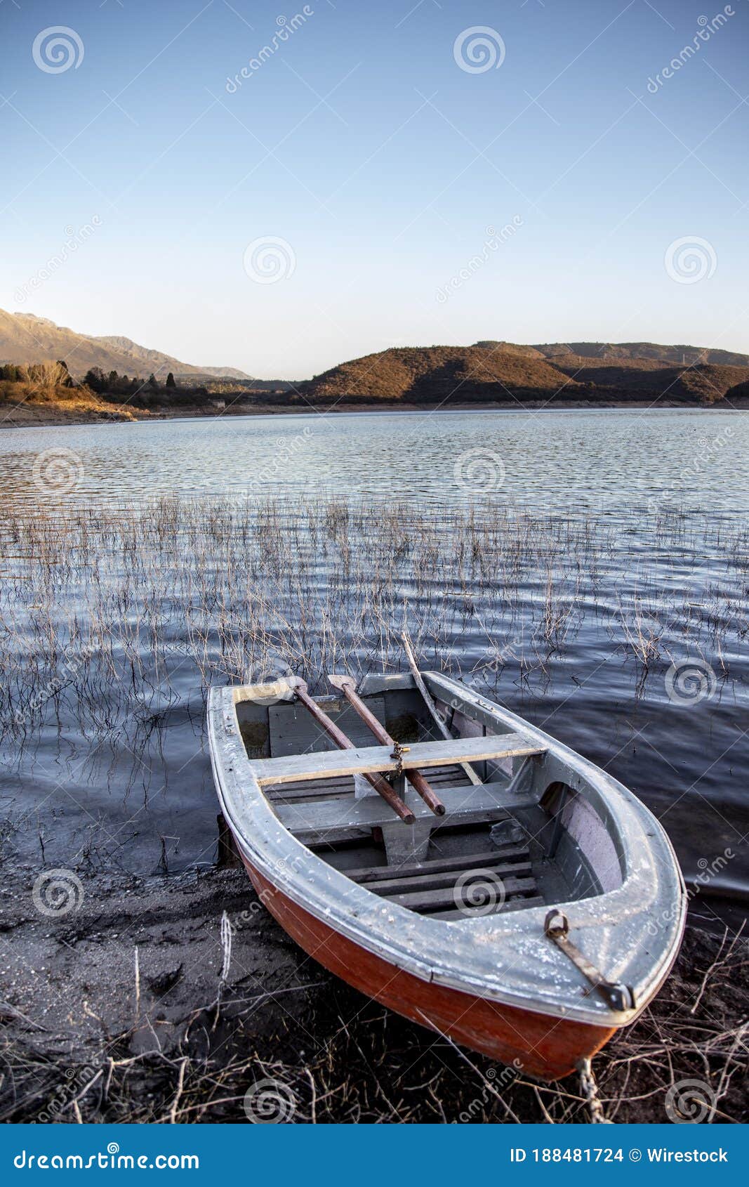 Vertical Image of a Rowboat at the Side of a Lake Stock Photo - Image ...