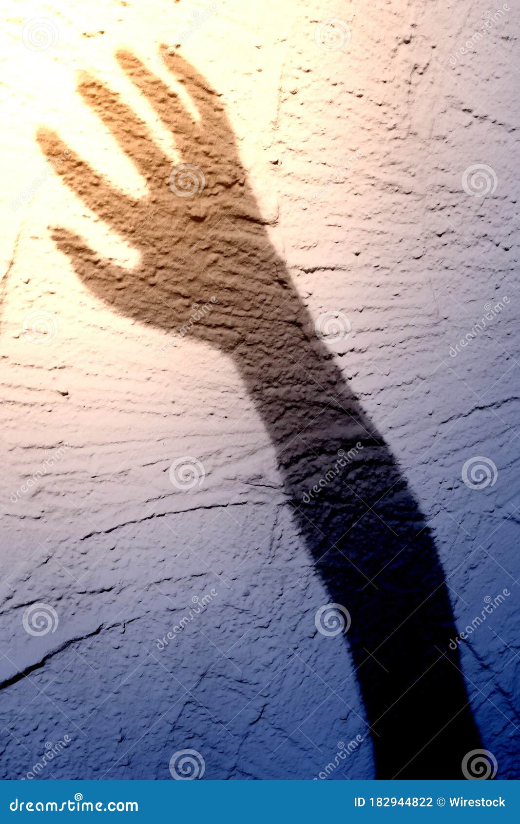 Vertical Image of a Shadow of an Arm Against a White Concrete Wall ...