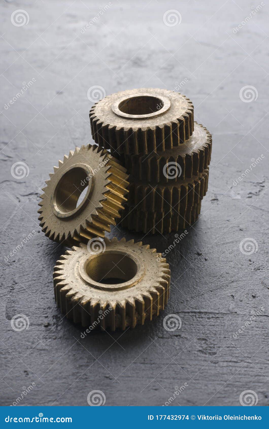 Vertical Image.Stack of Bronze Colored Gears on the Dark Surface Stock ...