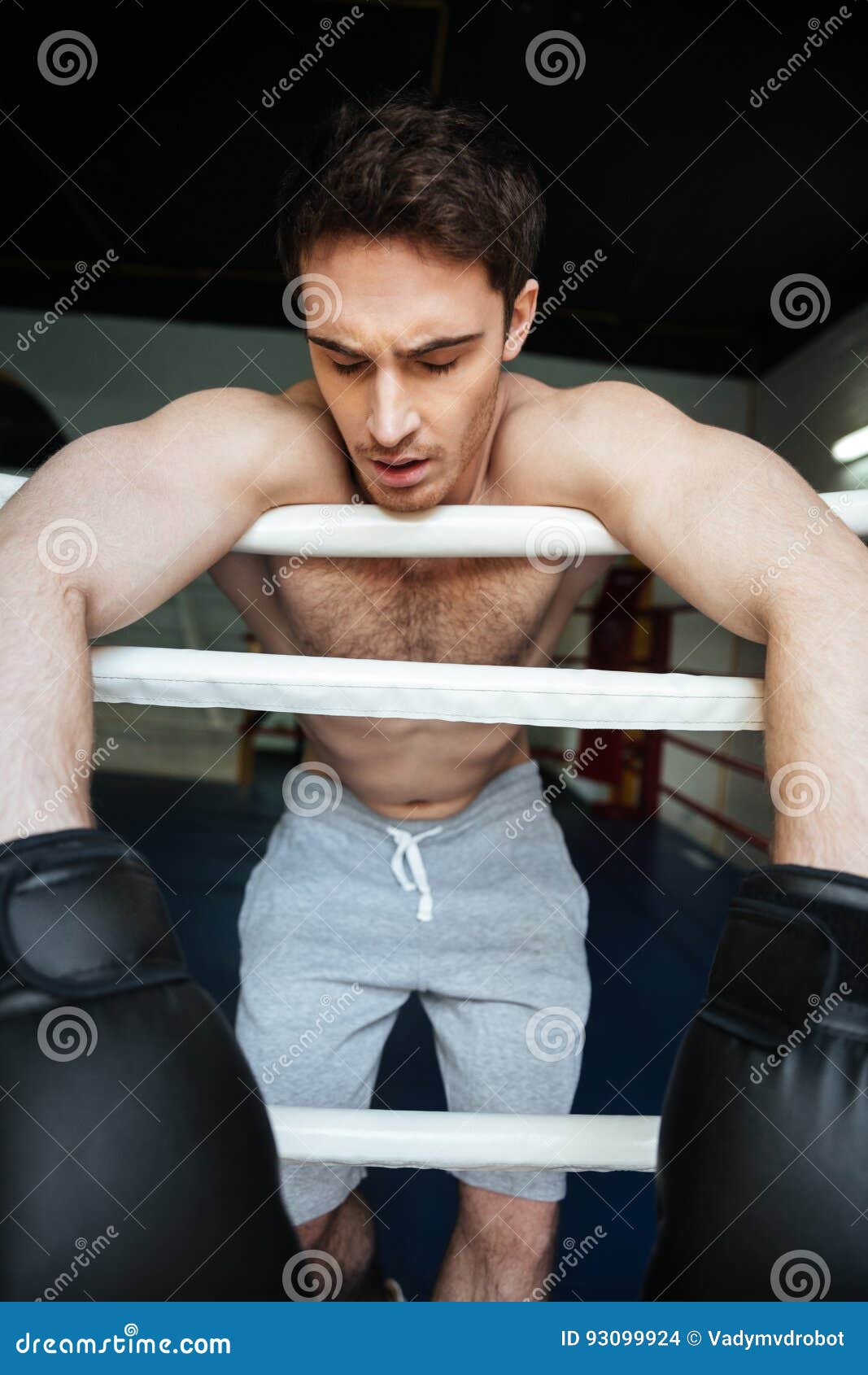 Vertical Image of Tired Boxer Relaxing in Boxing Ring Stock Photo ...