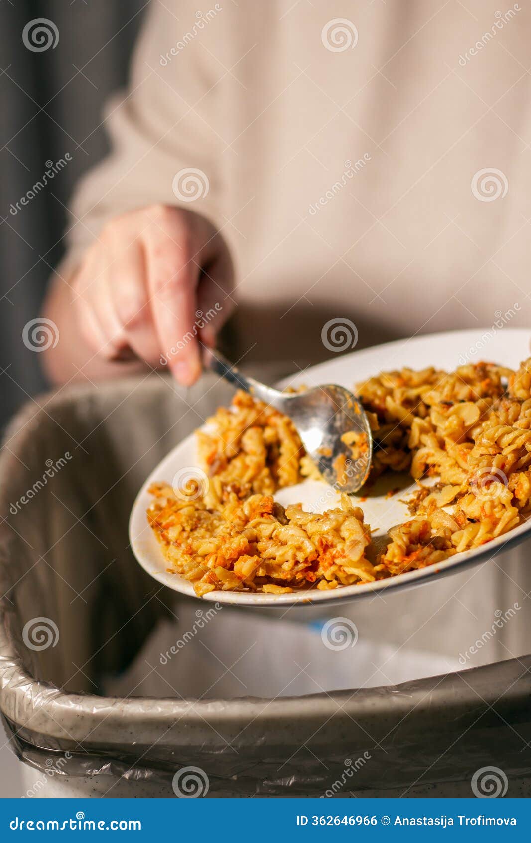 Vertical Image of Woman Holding Food Plate and Throwing Away Food ...