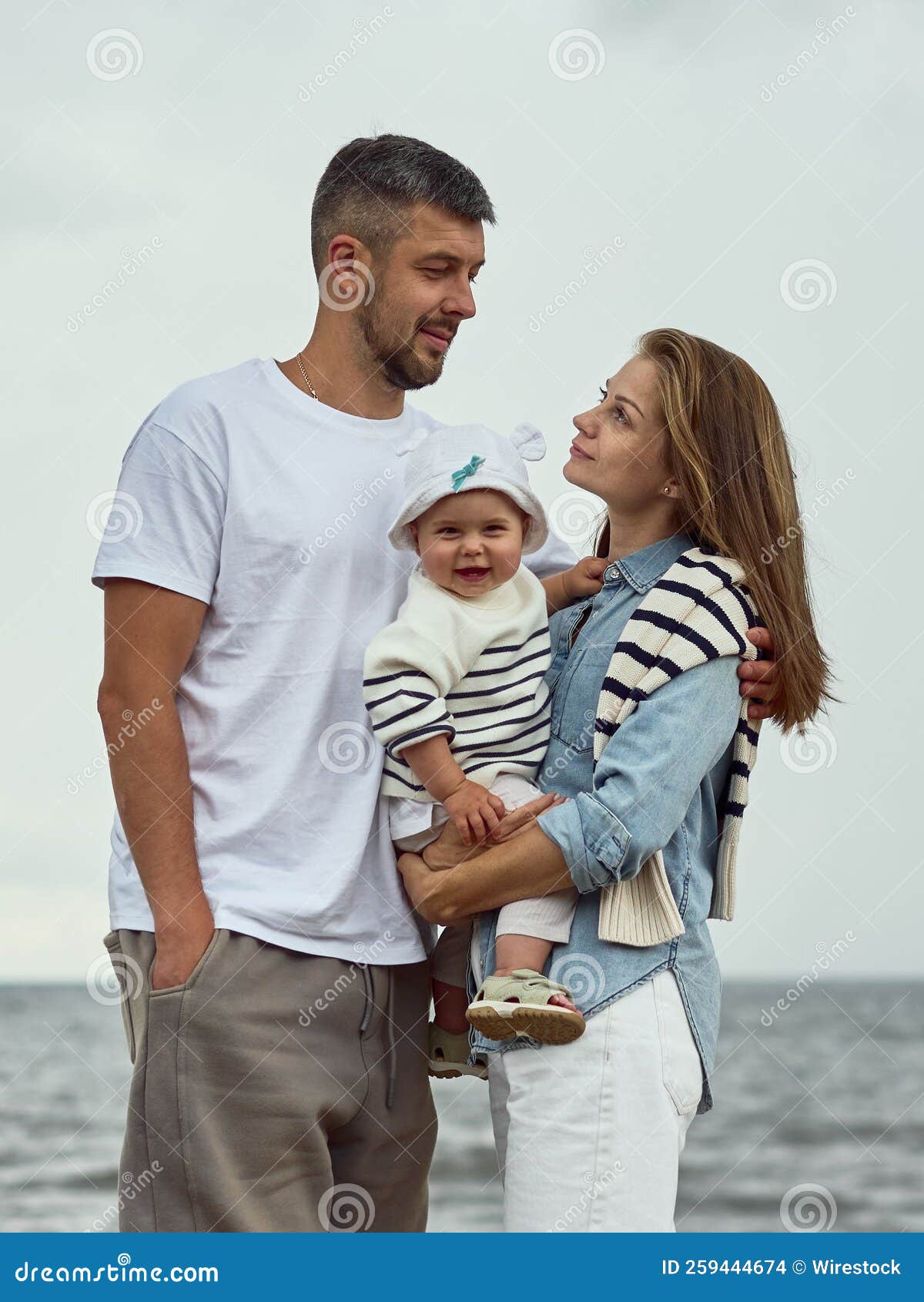 Vertical Loving Family Portrait at the Shore Stock Photo - Image of ...