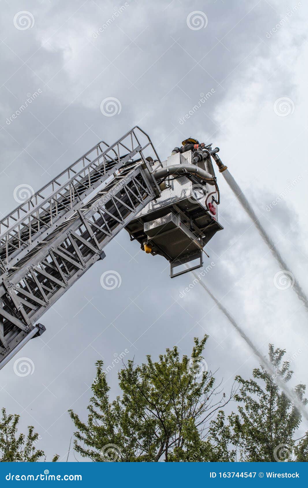 Vertical Low Angle Shot of a Crane at the Time of Construction Under ...