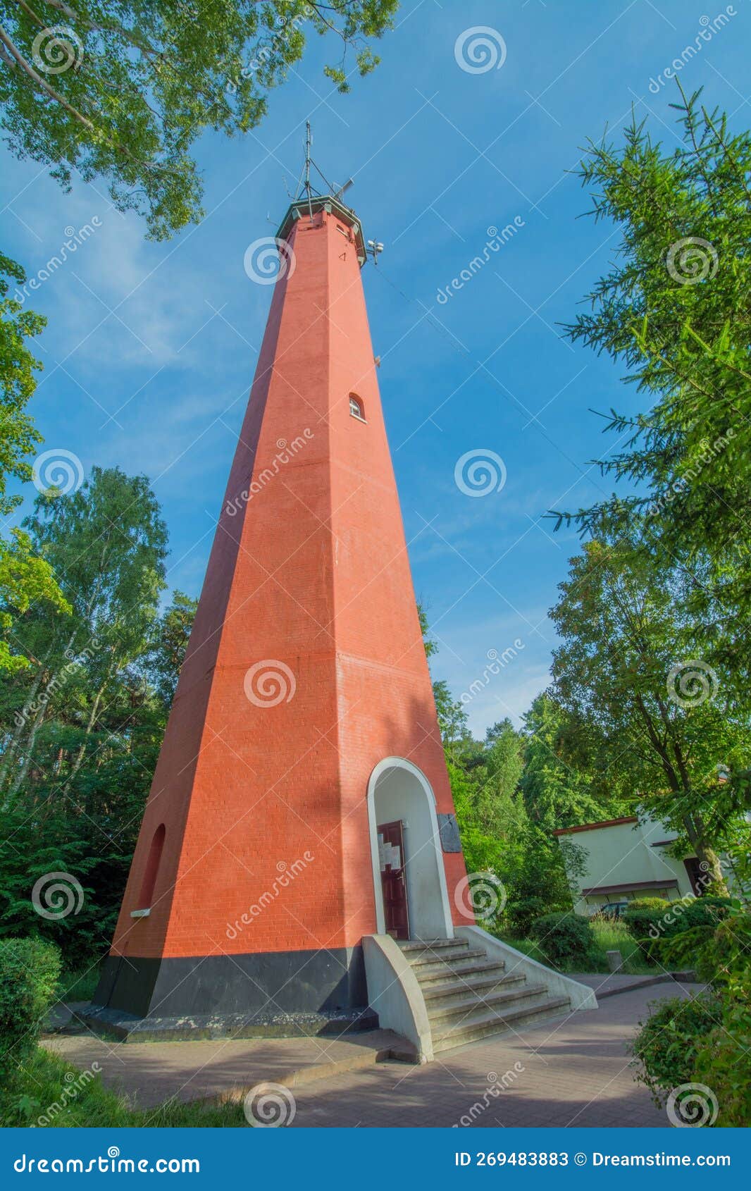 Vertical Low-angle Shot of the Hel Lighthouse with a Cloudy Blue Sky in ...