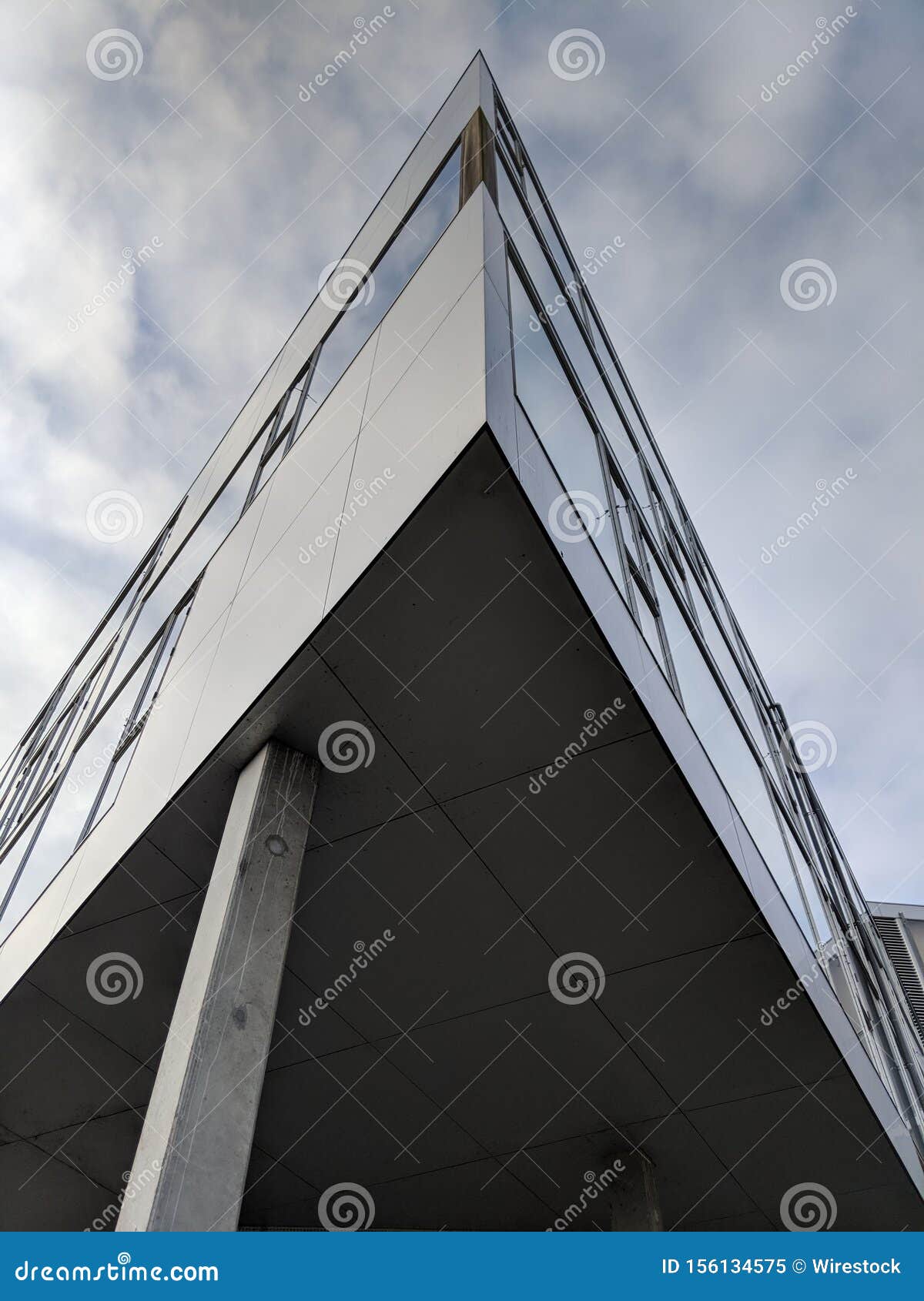 Vertical Low Angle Shot of a High Rise Triangular Building Stock Image ...