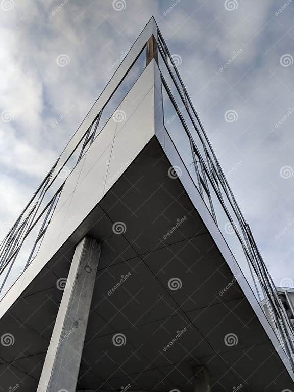 Vertical Low Angle Shot of a High Rise Triangular Building Stock Image ...