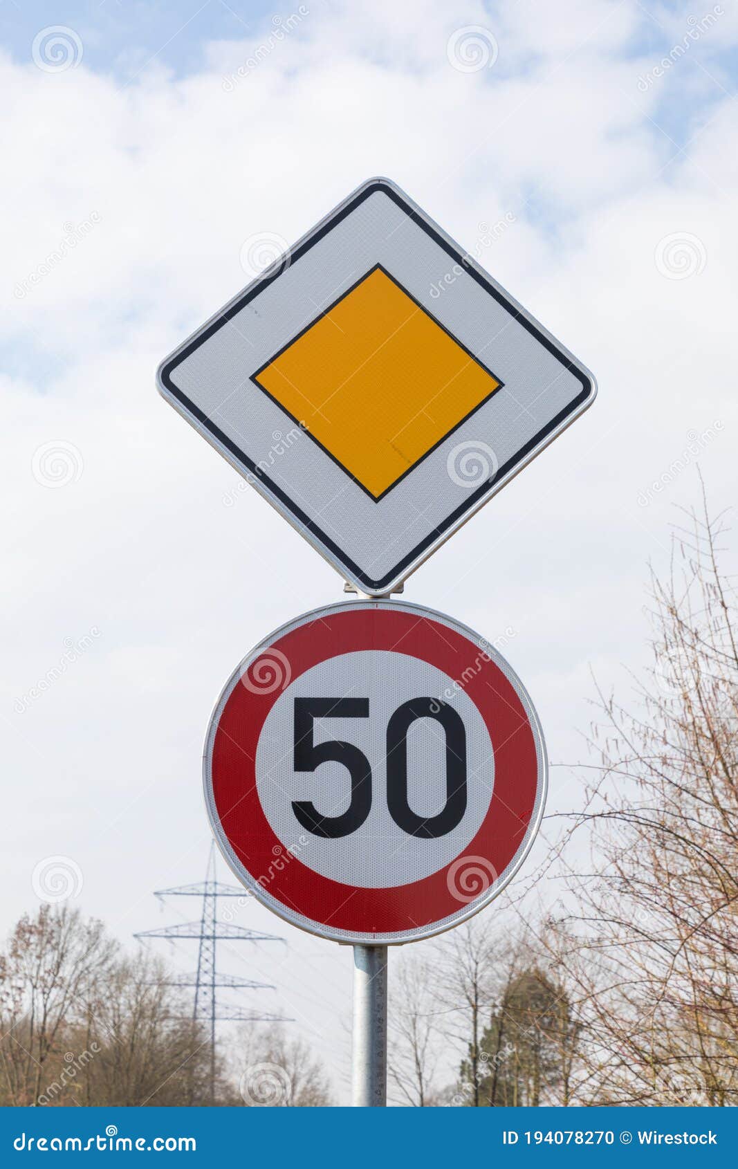 Vertical Low Angle Shot of the Traffic Sign for Priority Road and Speed ...