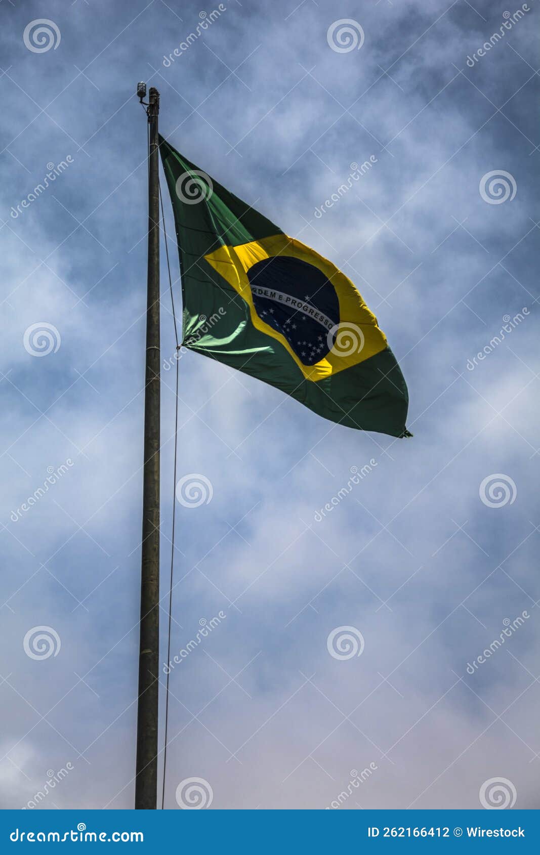 Vertical Low Angle Shot of the Waving Flag of Brazil Under the Dark ...