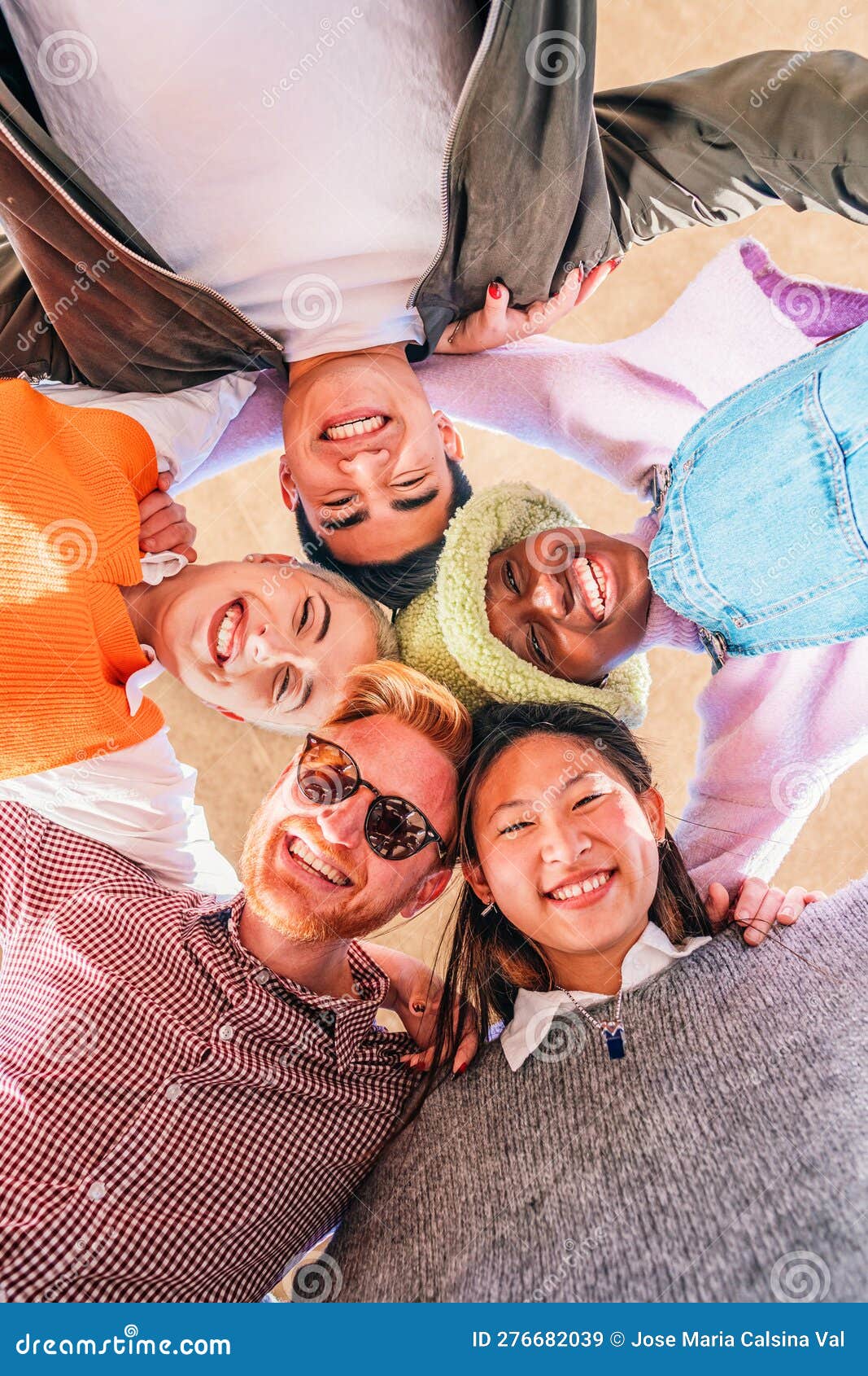 Vertical Low Angle View of a Multiracial Happy Young Friends Having Fun ...