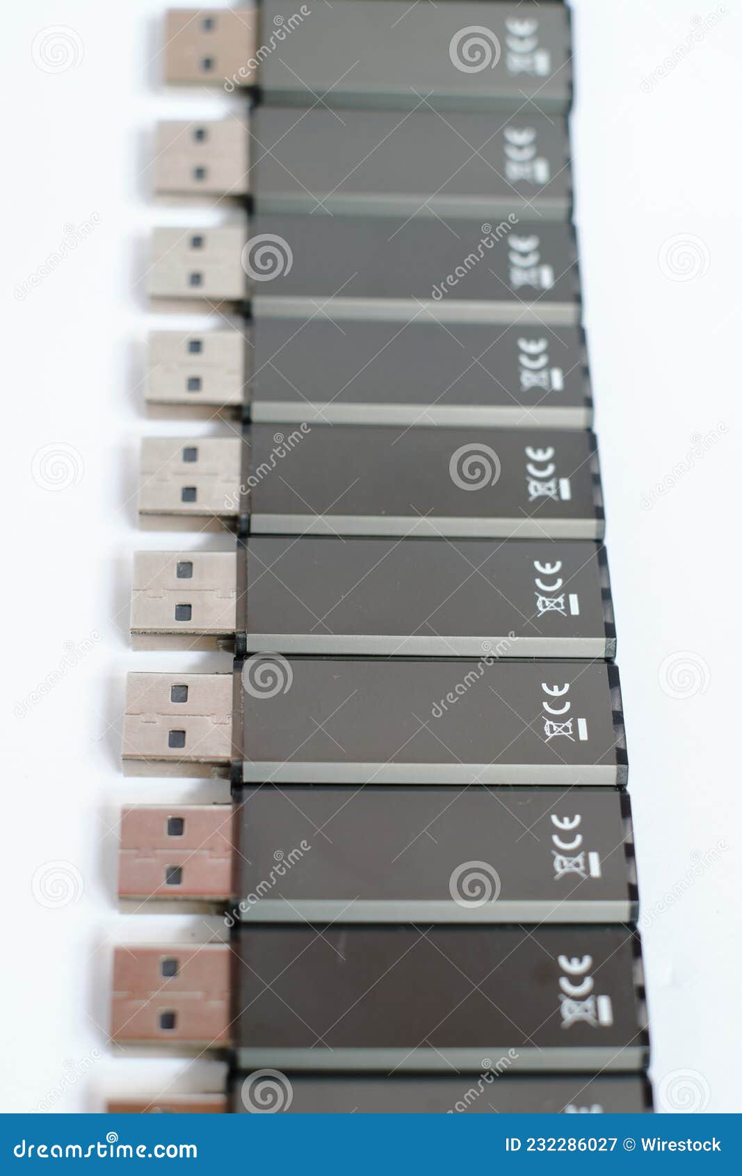 Vertical Macro Shot of Many Black USB Sticks in a Row with White ...