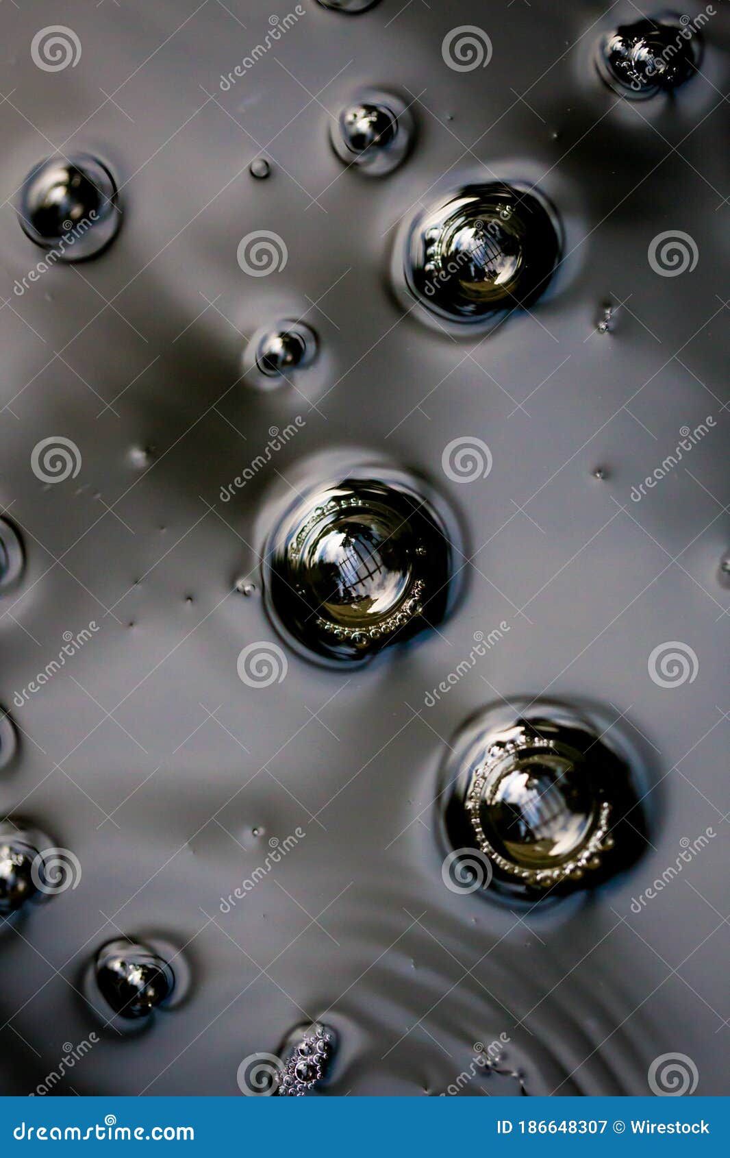Vertical Macro Shot of Rain Drops in Water Surface Stock Image - Image ...