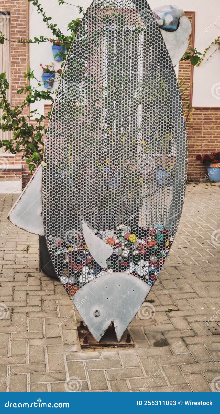 Vertical of a Metallic Recycling Bin in the Shape of a Fish for Plastic ...