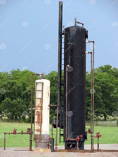 Vertical Oil Tanks and Pumps Stock Image - Image of tree, valve: 1865393
