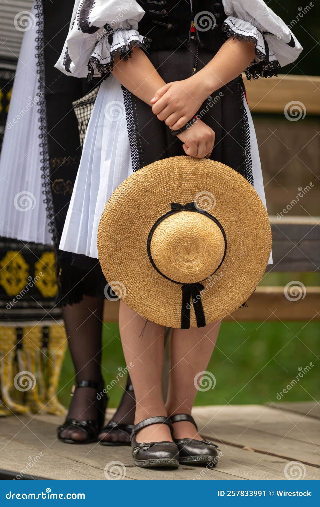 Vertical Partial View of a Woman Wearing a Traditional Dress and ... Vertical Partial View of a Woman Wearing a Traditional Dress and ...