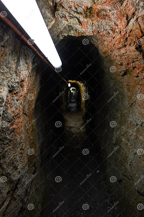 Vertical of the Pathway through a Cave Tunnel Stock Photo - Image of ...