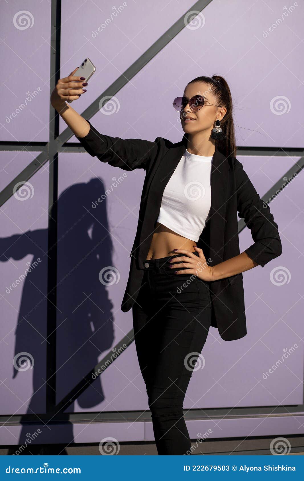 Beautiful Young Woman With Abdominal Muscle Isolated On Violet Wall