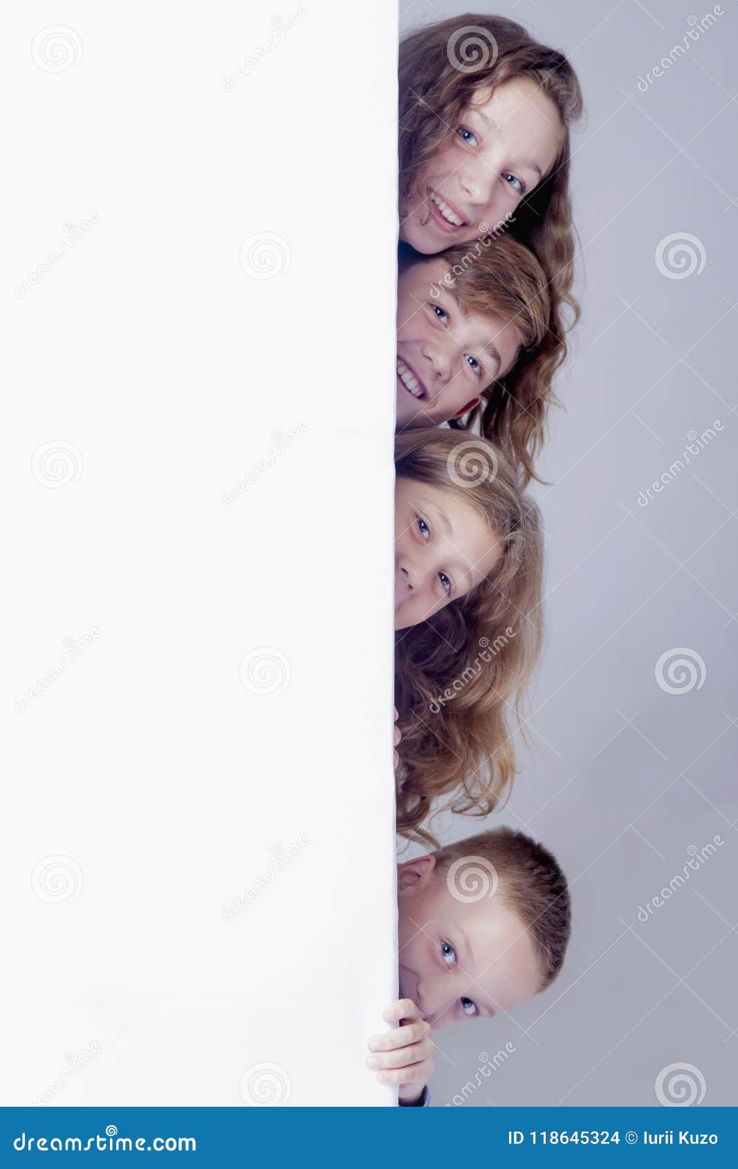 Vertical Photo: Happy Children Behind a White Board Stock Photo - Image ...