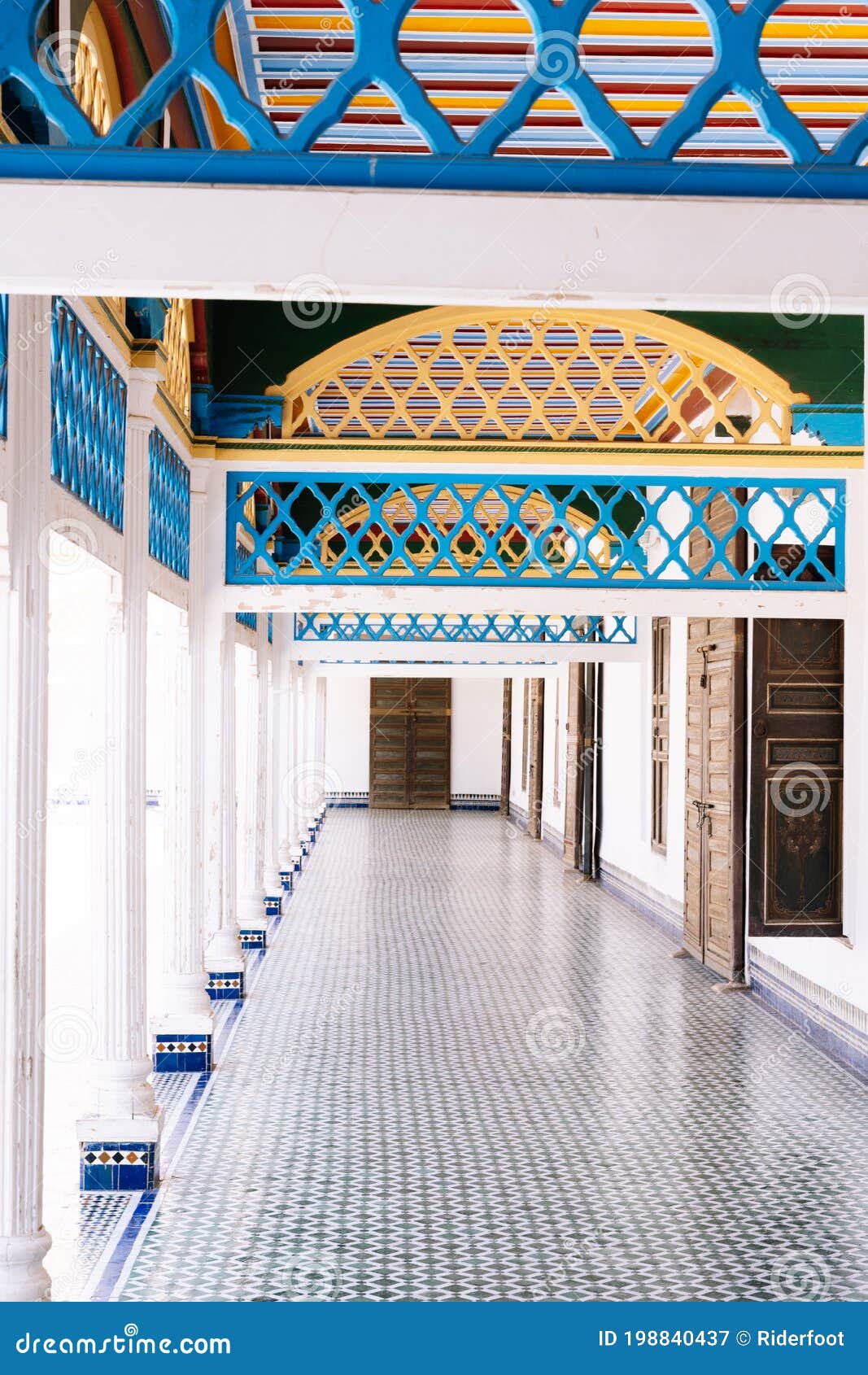Vertical Photo of an Inner Courtyard with Different Doors and Columns ...