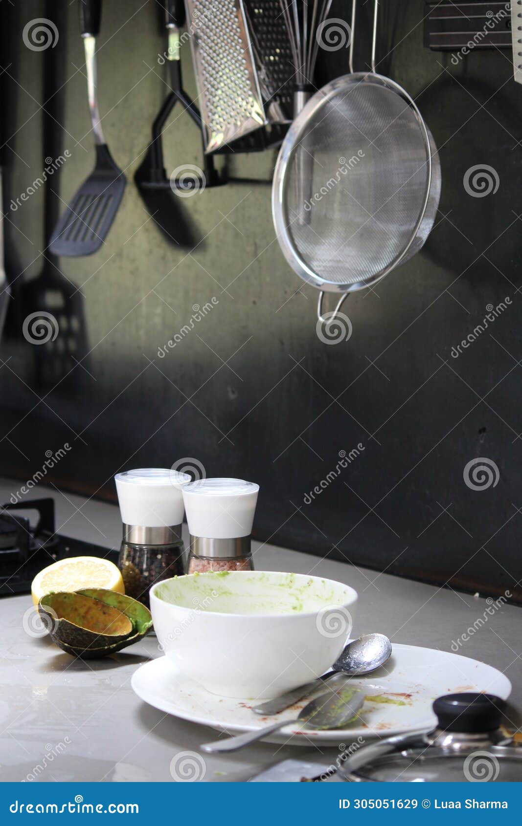 Vertical Photo of a Kitchen Counter with Cooking Tools Hanging Stock ...