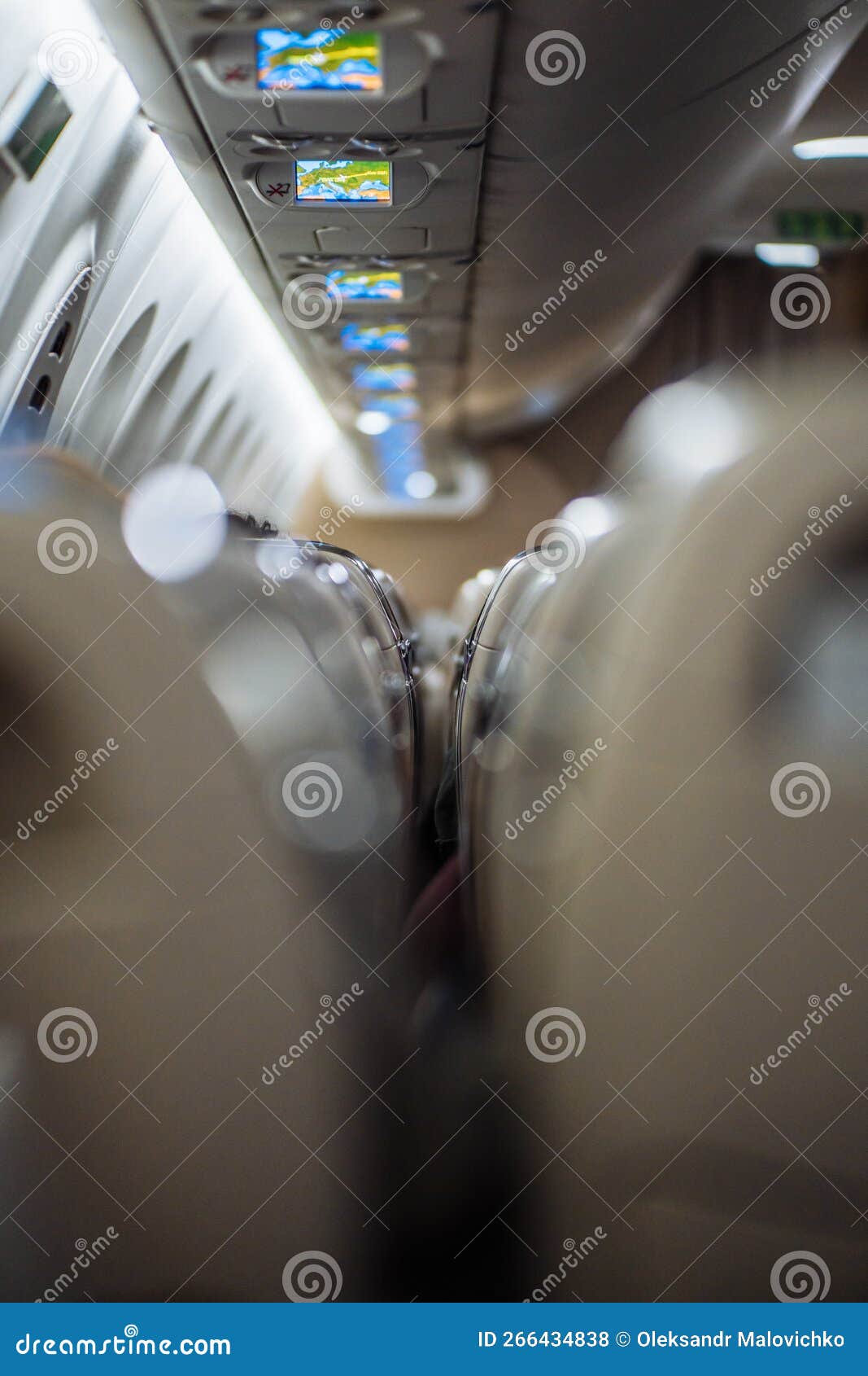 A Vertical Photo of the Plane S Interior between the Rows of Seats ...