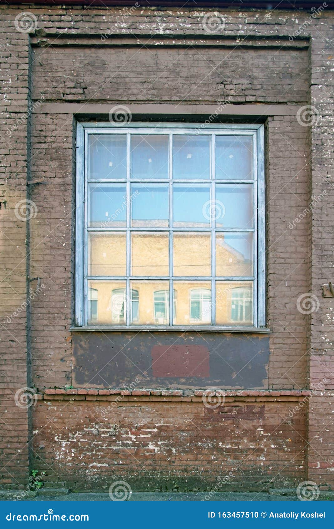 Vertical Picture. Brickwork and a Window in the Wall. Reflection in a ...