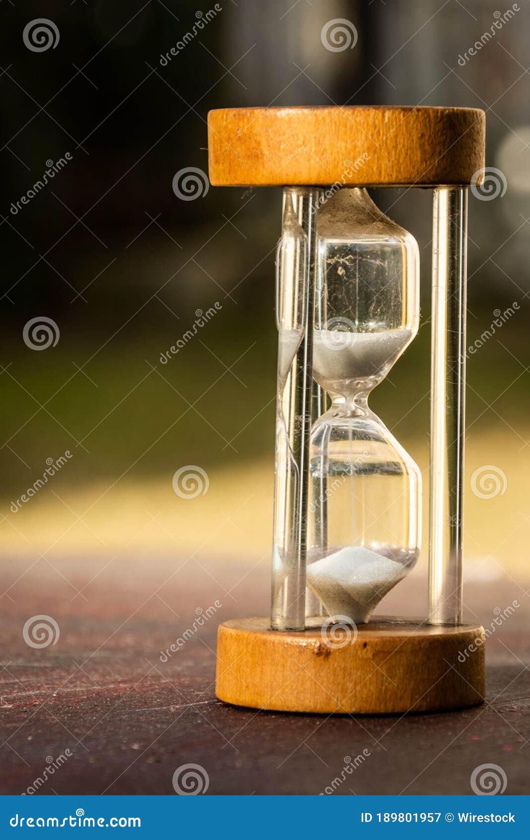 Vertical Picture of an Hourglass on a Wooden Surface Stock Image ...
