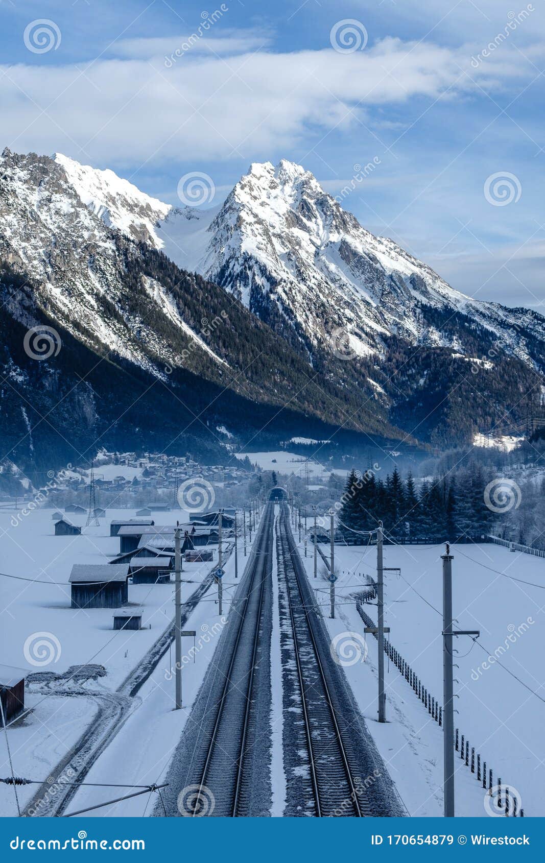 Vertical Picture of a Railway Surrounded by Rocks Covered in Forests ...