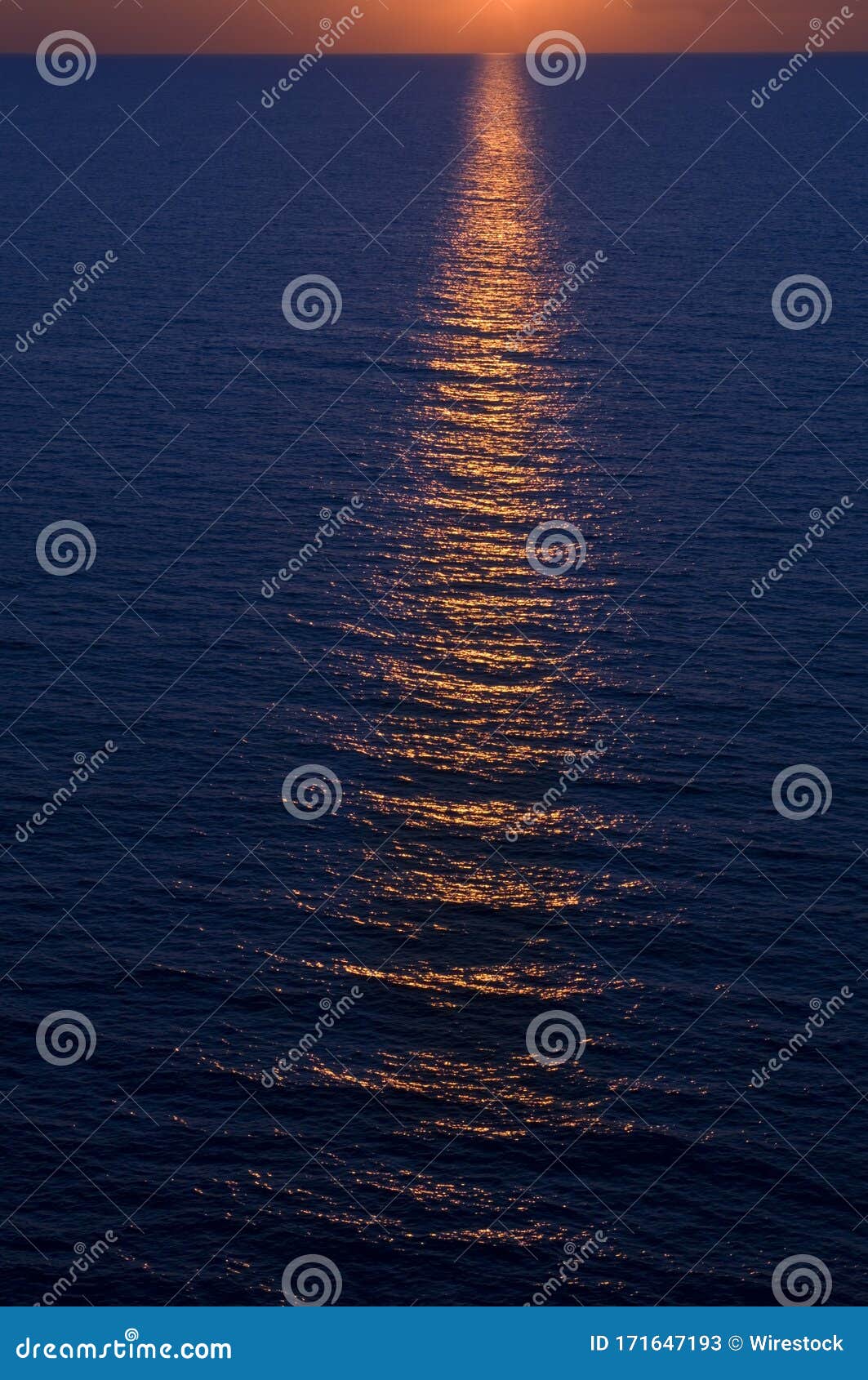 Vertical Picture of the Sea with the Sunset Reflecting on the Water in ...