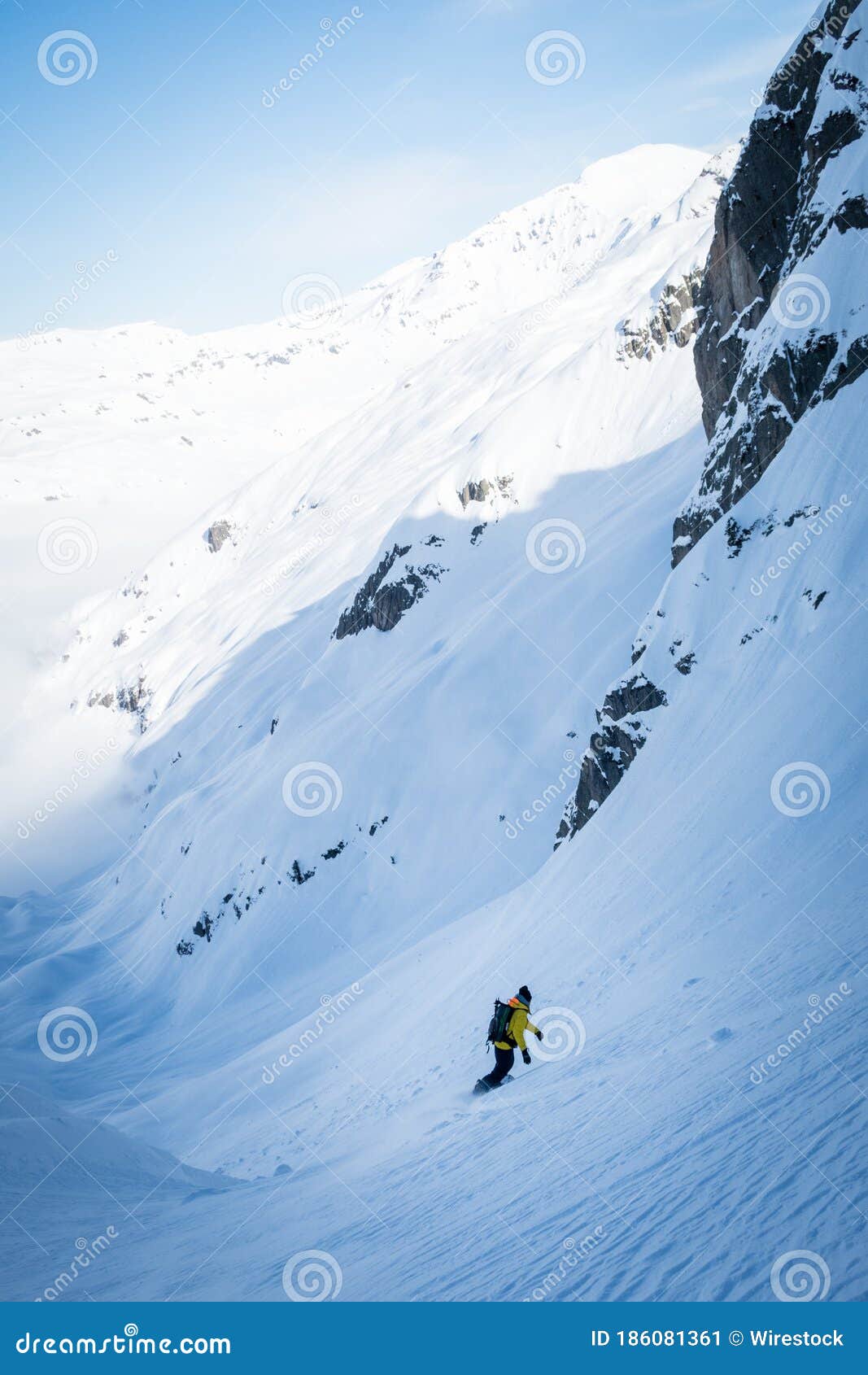Vertical Picture of a Skier on the Snowy Mountain Under the Sunlight ...