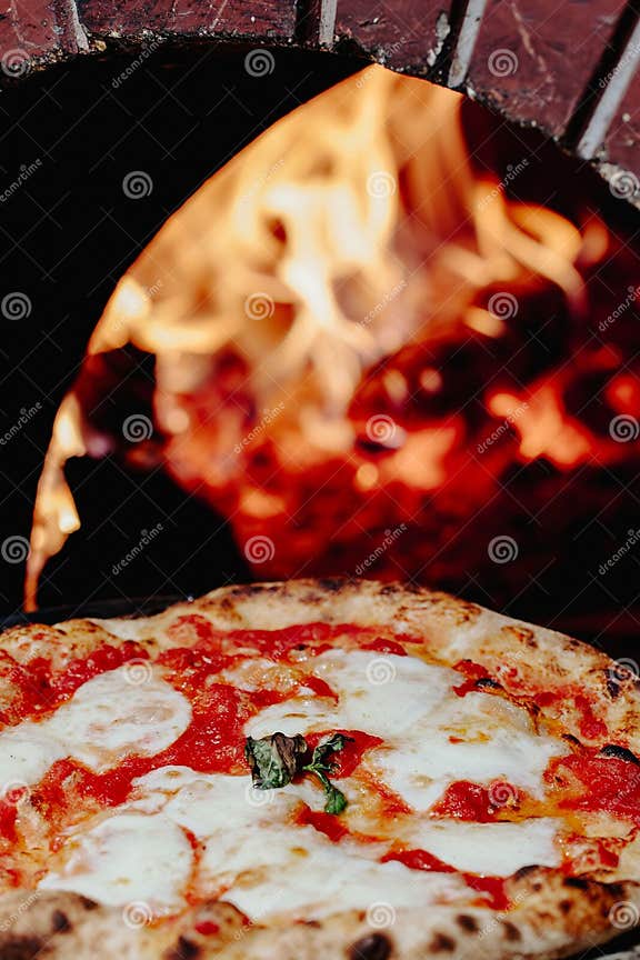 Vertical of a Pizza Cooked in the Oven Stock Photo - Image of oven ...