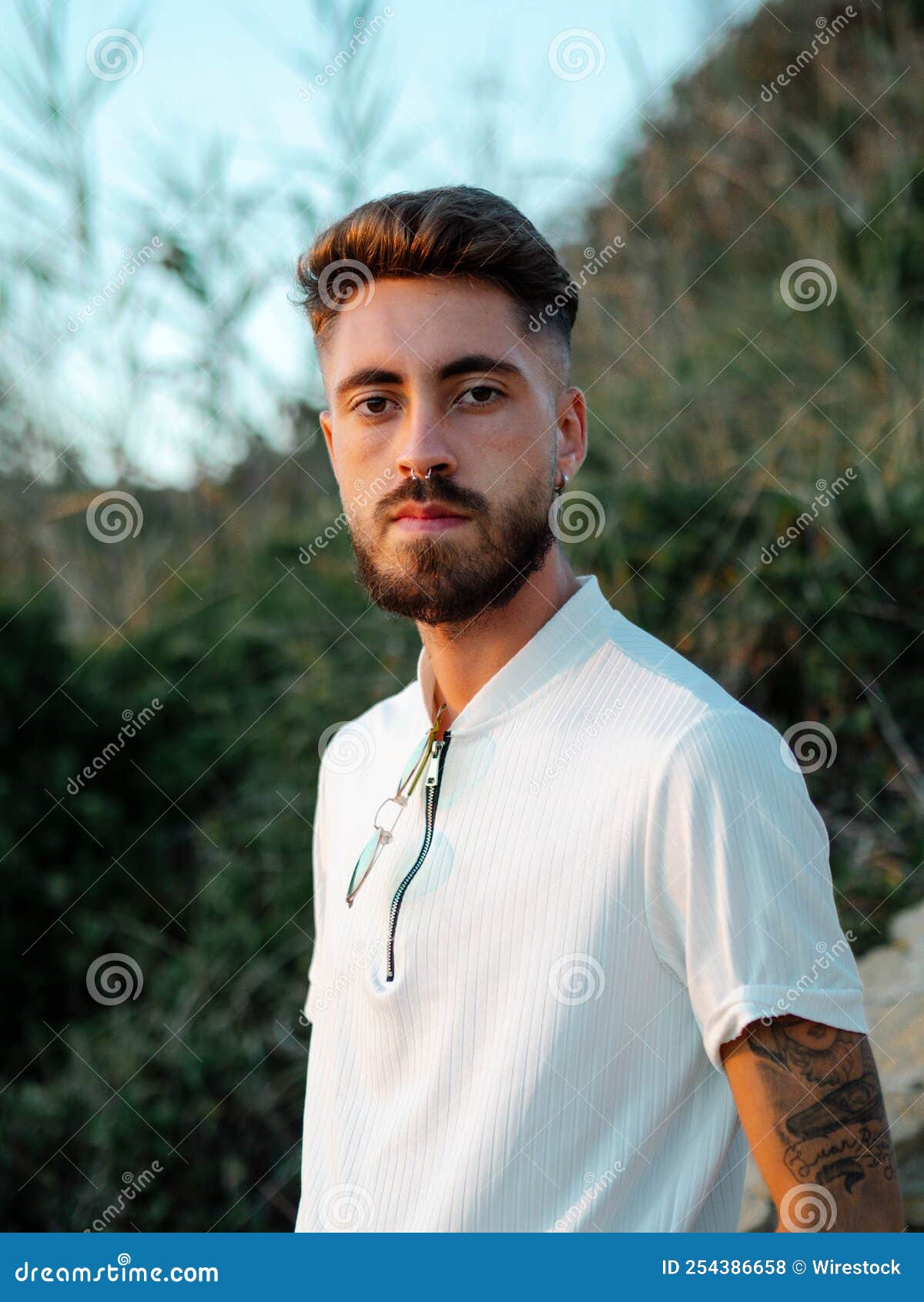 Vertical Portrait of a Caucasian Guy with a Beard and Piercing, Looking ...