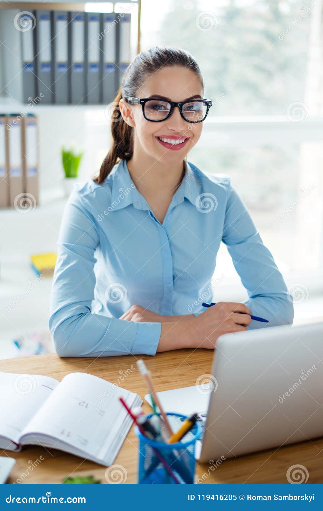 Vertical Portrait of Pretty Smiling Office Worker Sitting at the Stock ...