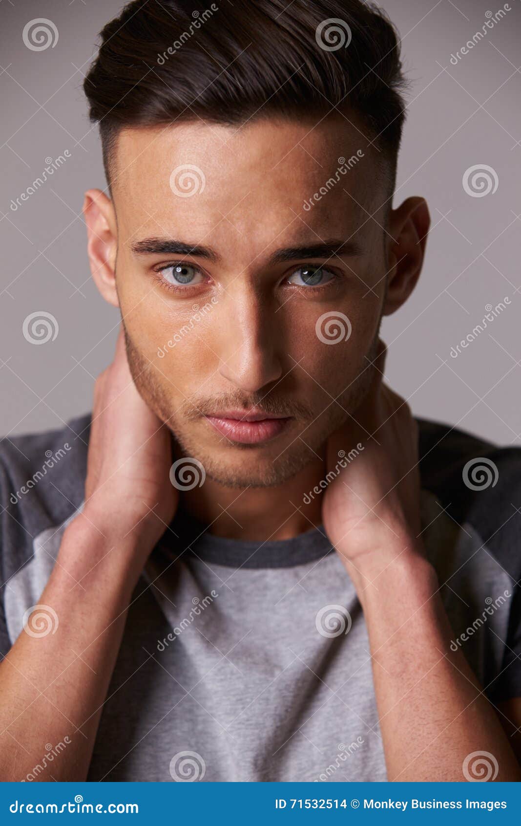 Vertical Portrait of Young Man, Holding His Neck Stock Photo - Image of ...