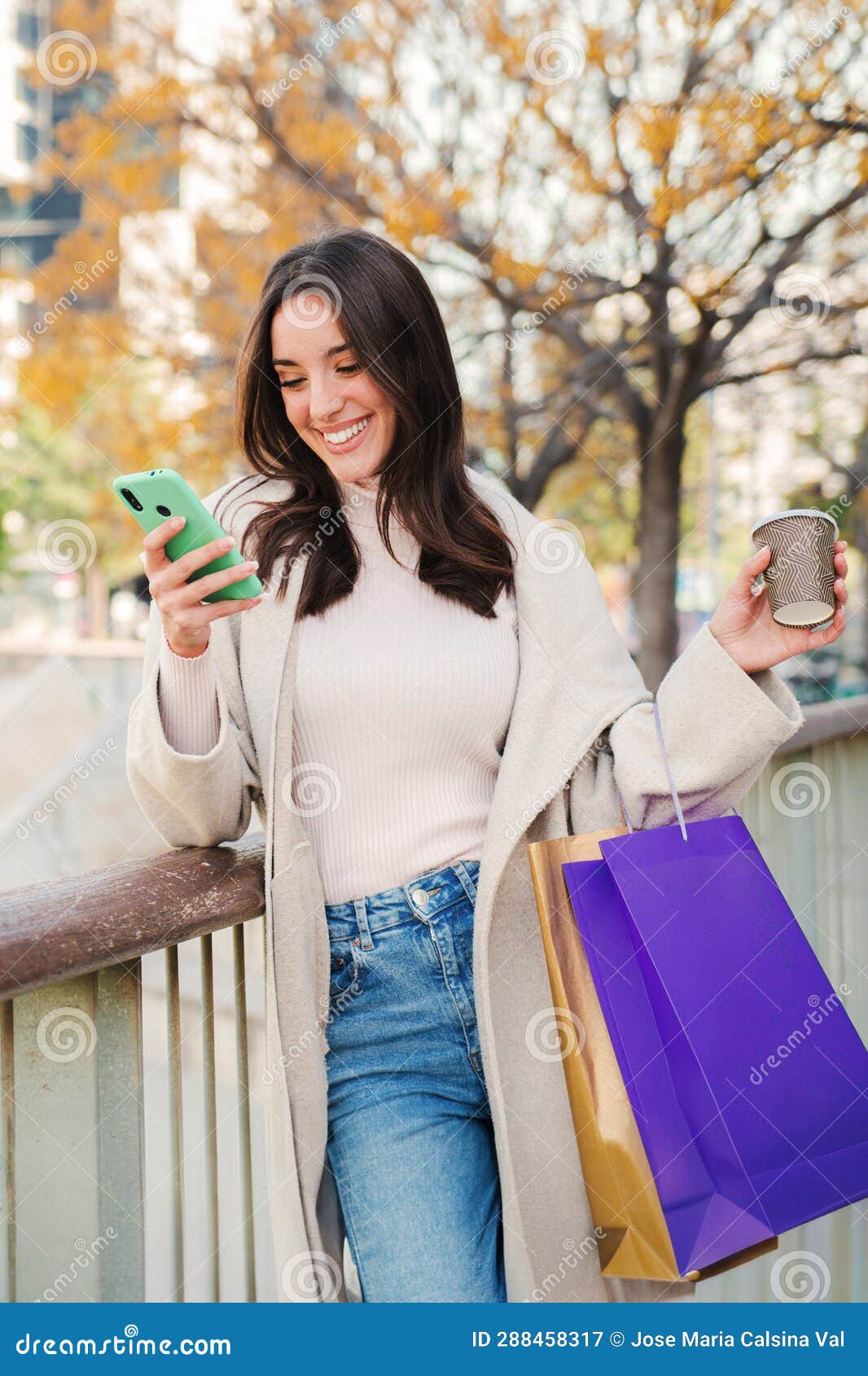 Vertical Portrait of a Young Woman Using a Cellphone, Texting a Message ...