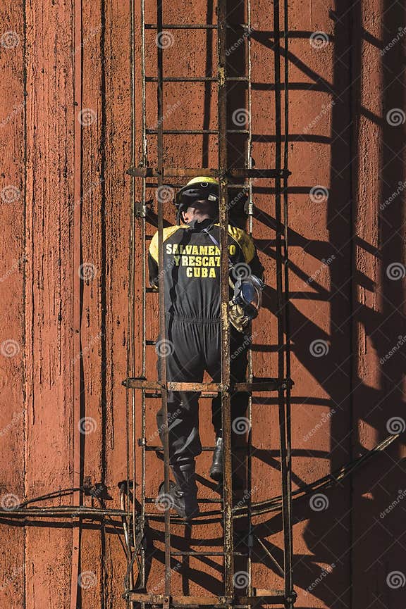 Vertical Rear View of a Cuban Firefighter Going Up a Fire Escape Stock ...