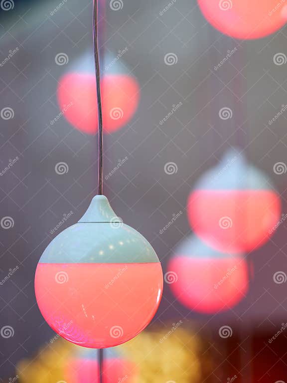 Vertical of Red Lightbulbs Hanging from a Ceiling Stock Image - Image ...